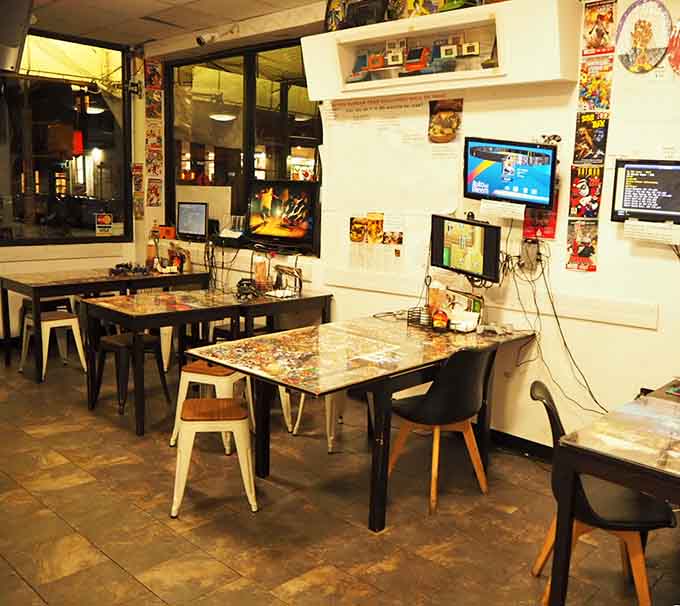 Comic book tables and gaming consoles create the perfect trifecta: eat, play, and actually enjoy family time for once.