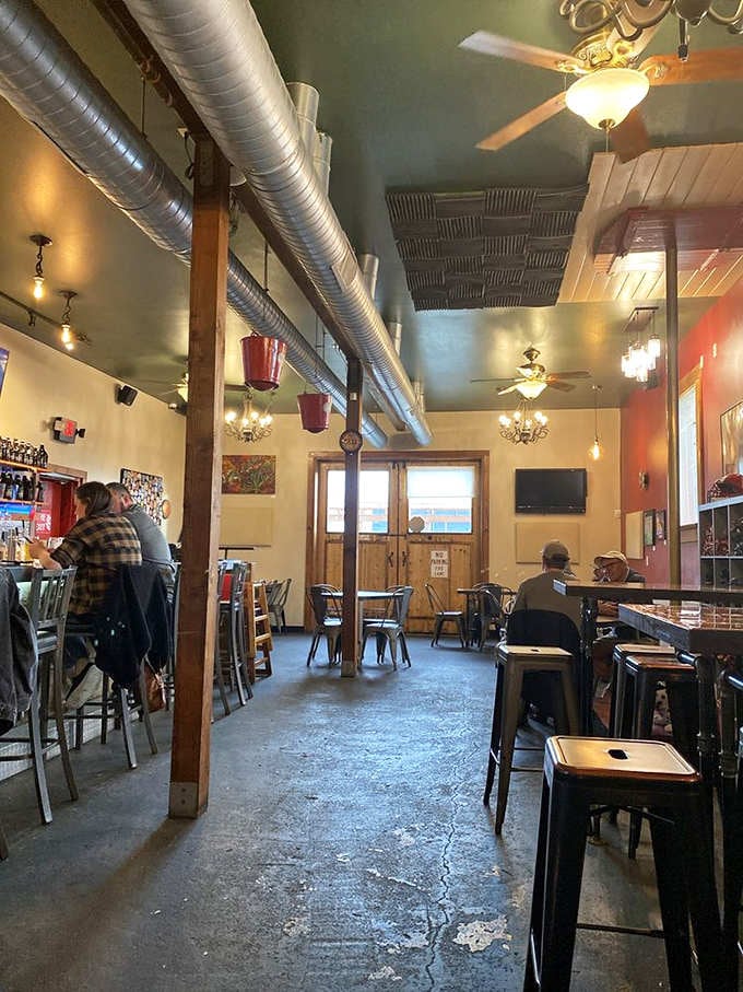 Industrial chic meets firefighter nostalgia in a space that somehow feels both expansive and wonderfully intimate.