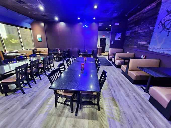 Modern lighting meets comfortable seating in a space that says "stay awhile" louder than your mother ever did.