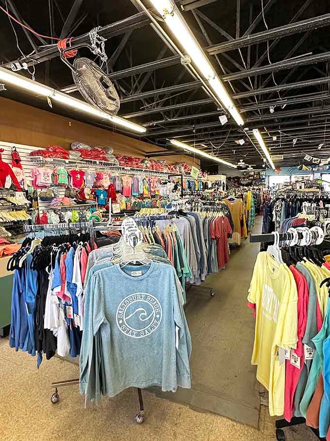 Rows of colorful apparel stretch endlessly under industrial ceilings that somehow feel welcoming rather than warehouse-like.