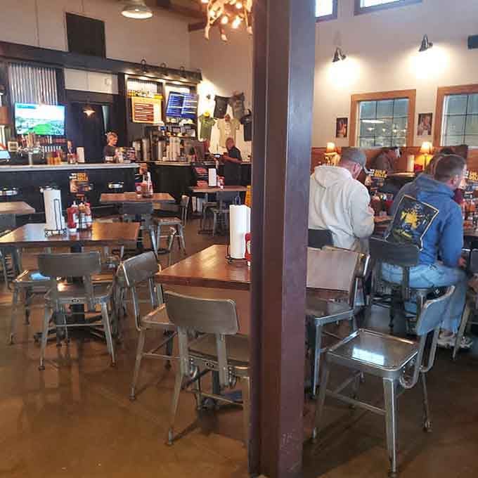 Industrial-chic meets down-home comfort in this spacious dining room where metal chairs and wooden tables await hungry guests.