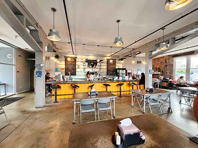 Industrial meets inviting with that sunshine-yellow counter beckoning you to pull up a stool and stay awhile.