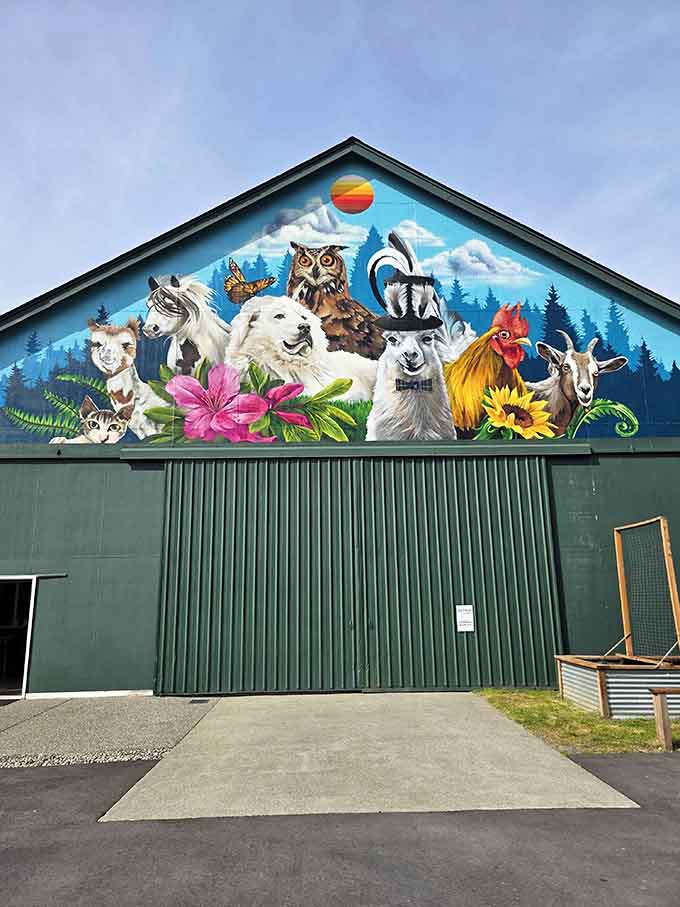This barn mural is like the Sistine Chapel of farm art, minus Michelangelo but plus adorable goats.