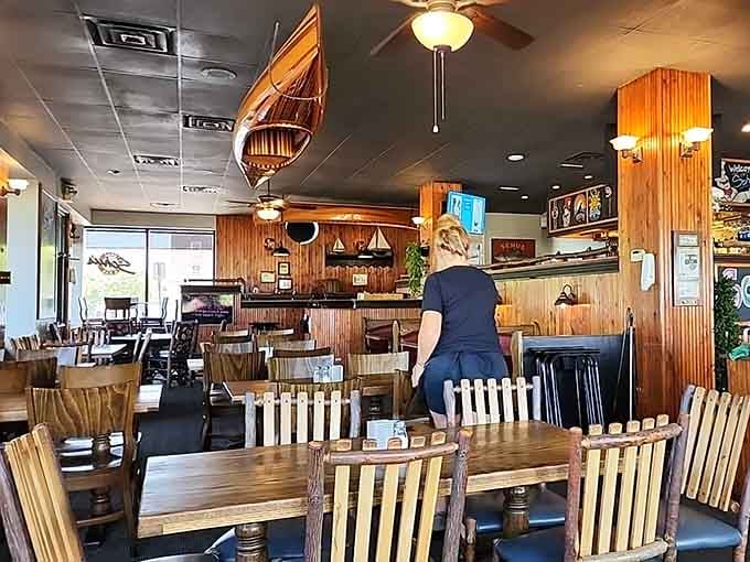 Wood paneling and nautical charm create the kind of atmosphere where strangers become friends over appetizers.