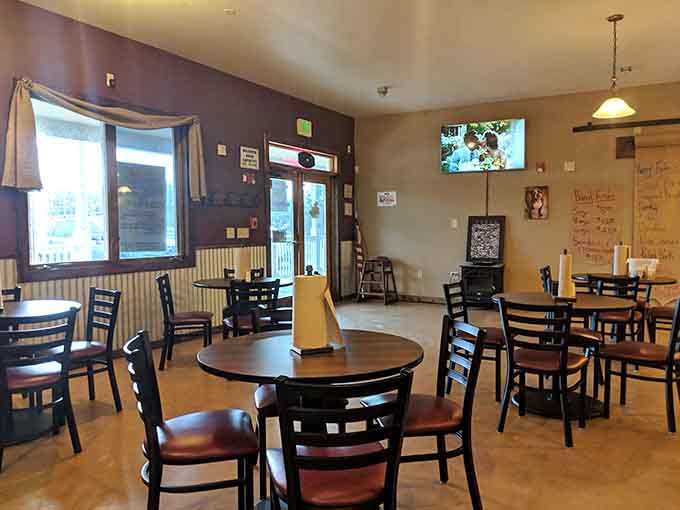 Simple tables, honest chairs, and walls that have absorbed years of smoky perfection, this is where comfort meets carnivore dreams.