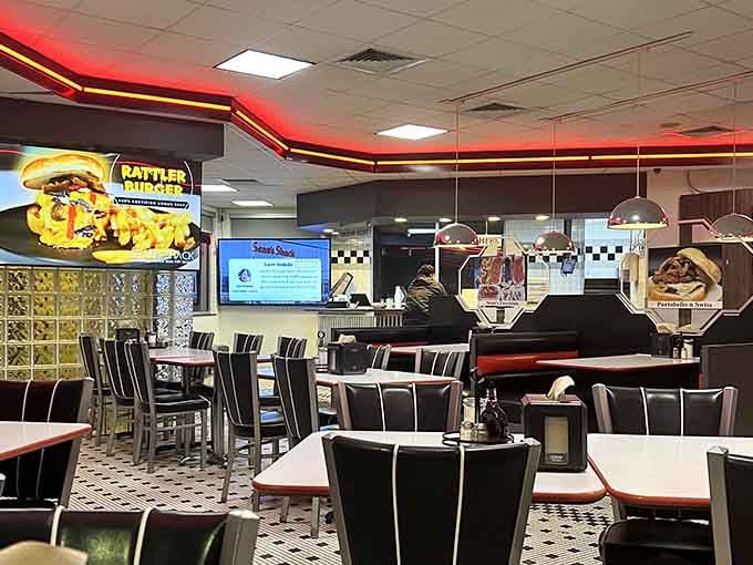 Red neon racing stripes and checkered patterns create that perfect diner atmosphere where calories don't count and memories are made daily.