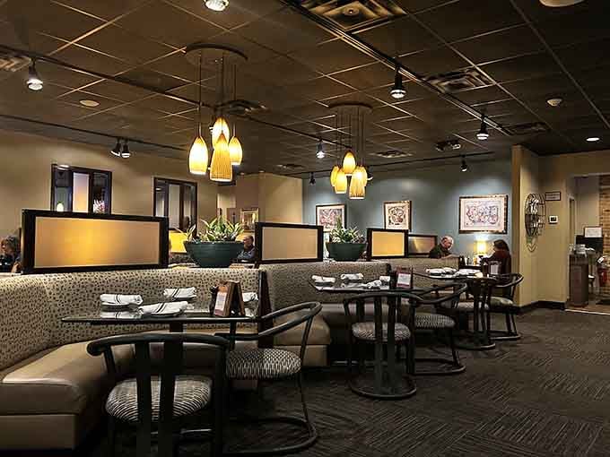 Warm lighting and comfortable booths create the kind of atmosphere where conversations flow as smoothly as the wine.