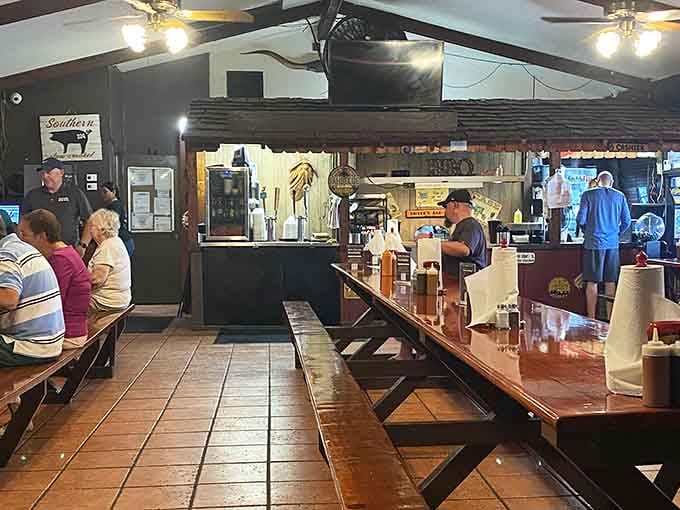Picnic tables and ceiling fans set the scene for no-nonsense barbecue dining at its finest.
