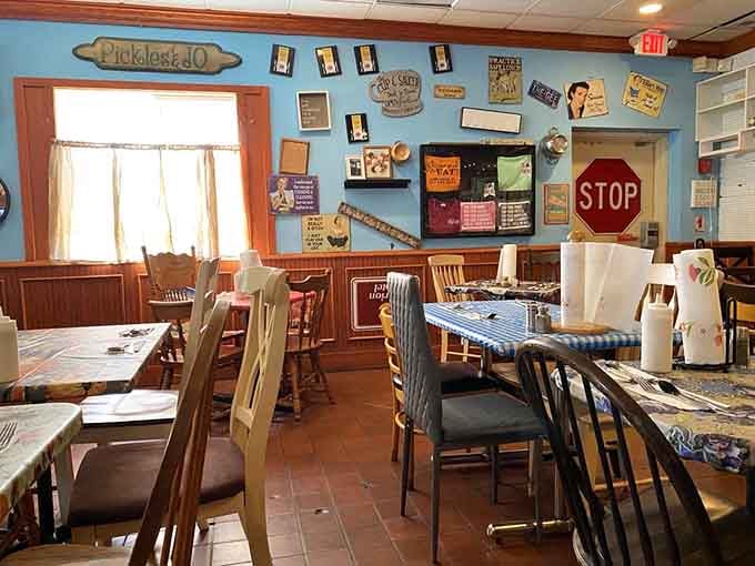 Every inch of wall space tells a story here, creating visual chaos that somehow feels like home.