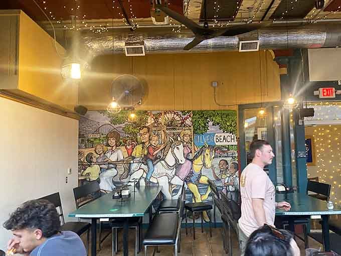 Inside, vibrant murals celebrate beach culture while diners enjoy their meals in this wonderfully unpretentious space.