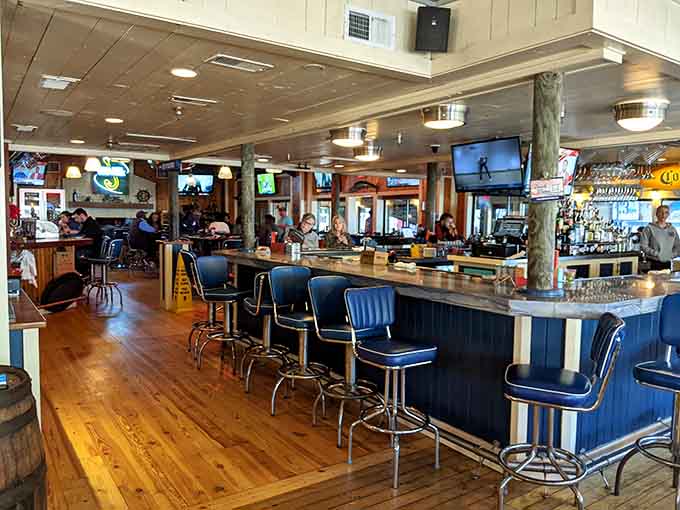 The bar beckons with coastal charm and enough TVs to keep everyone happy, even the sports fans.