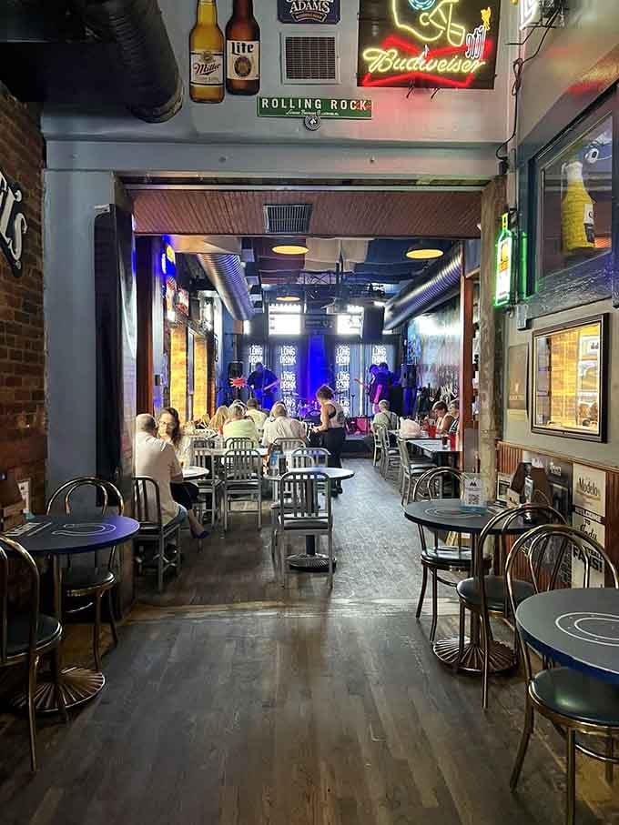 The view down this corridor tells you everything: live music ahead, cold drinks waiting, good times guaranteed.