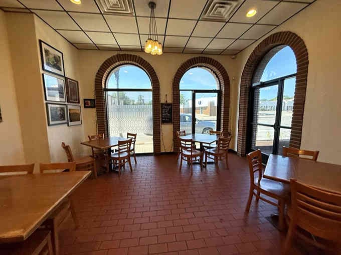 Those gorgeous arched windows flood the dining room with natural light, making every meal feel like a special occasion.
