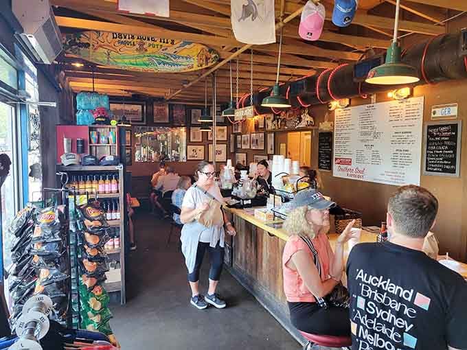 Inside, surfboards hang overhead while hungry souls line up for smoky salvation at the counter below.
