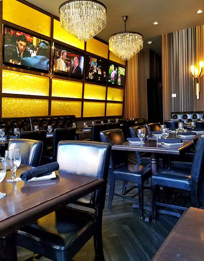 Crystal chandeliers and backlit amber walls create an atmosphere that whispers "special occasion" even on a Tuesday night.