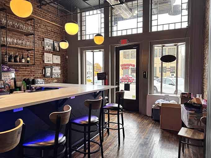 Exposed brick meets superhero chic in a space where your inner child and your adult appetite finally agree.