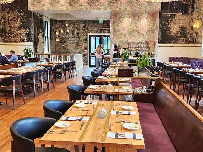 Wooden tables and plush seating transform a sacred space into the most divine dining room you'll encounter.