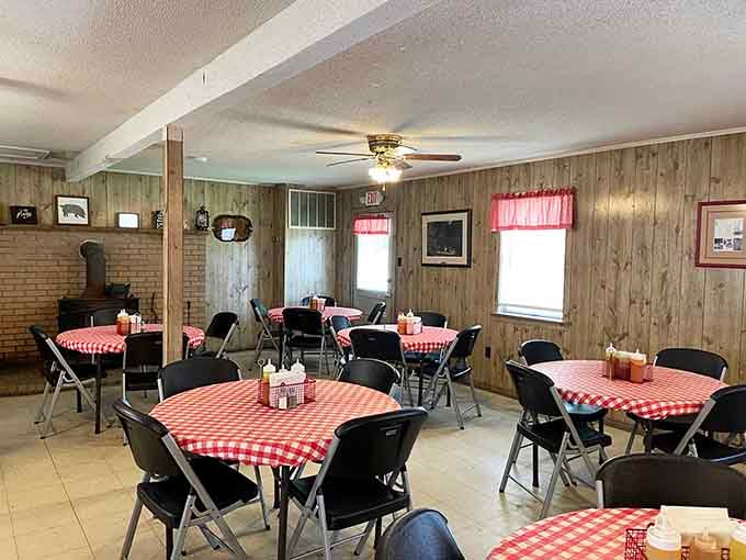 Red checkered tablecloths signal serious eating ahead, like a delicious warning system that your belt is about to regret everything.