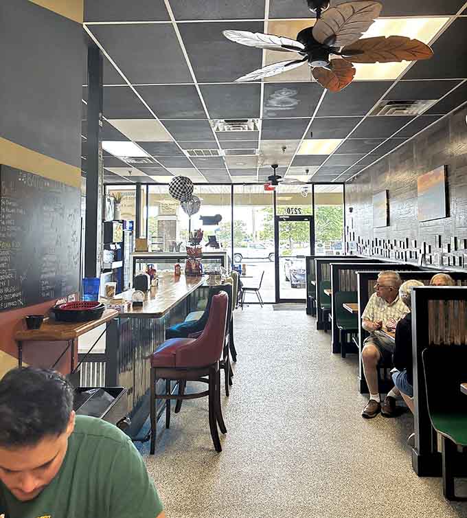 Step inside and discover a welcoming space where tropical ceiling fans meet serious food in the best way.