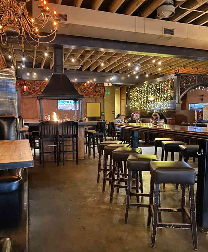 String lights and exposed beams create an atmosphere that says "stay awhile" louder than any hostess ever could.