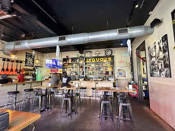 Where motor oil once flowed, margaritas now reign supreme in this brilliantly repurposed industrial space that feels authentically cool.