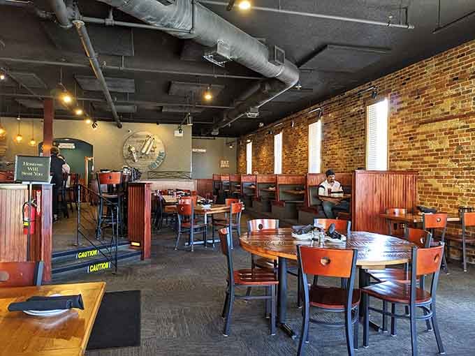 Exposed brick, industrial chic, and enough warm lighting to make everyone look good in their food photos.