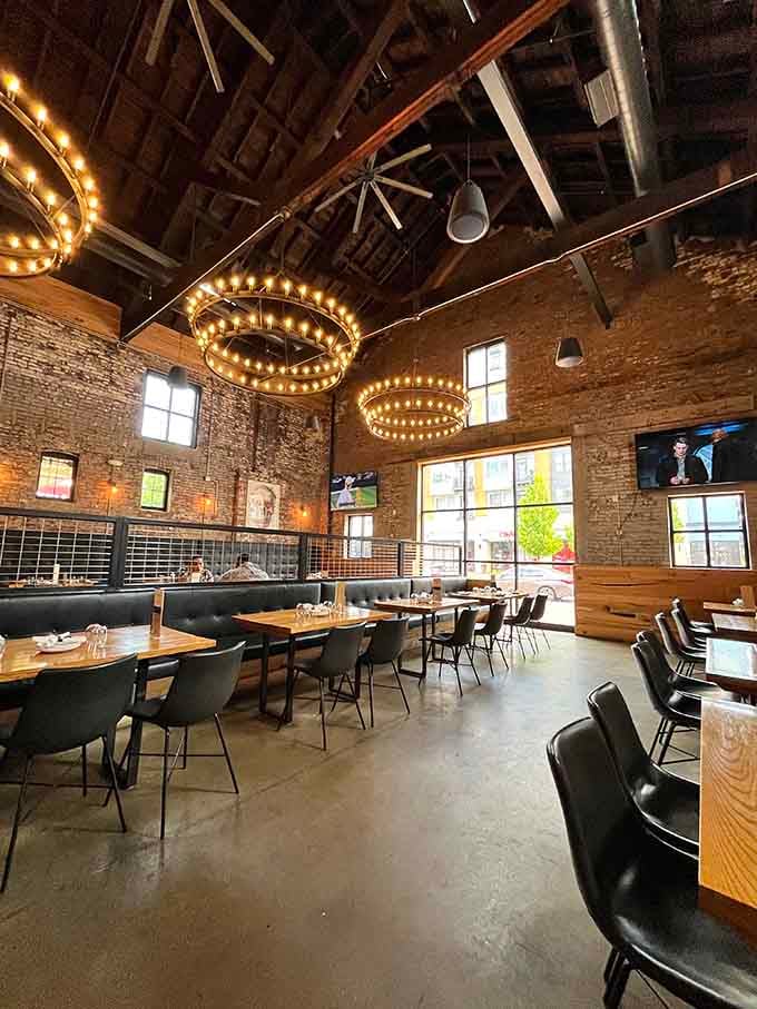 Those soaring ceilings and warm lighting create the kind of atmosphere where time slows down and conversations flow freely.