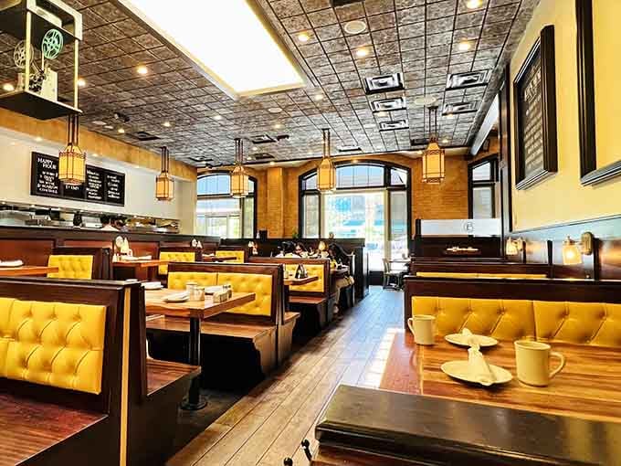 Those yellow booths aren't just seating, they're happiness upholstered and ready to cradle your breakfast-loving soul.