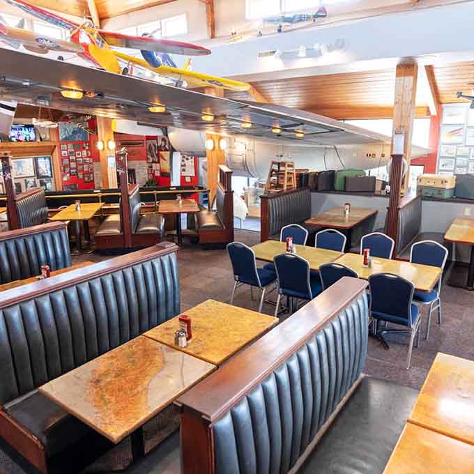 Step inside and discover booth seating that's actually comfortable, proving airplanes can be cozy when they're not flying.