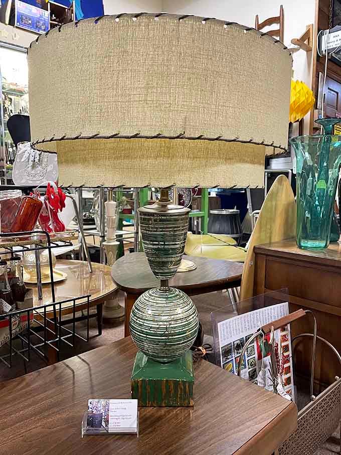 That textured lampshade perched on striped glass screams 1960s cocktail party, minus the fondue and questionable appetizers.