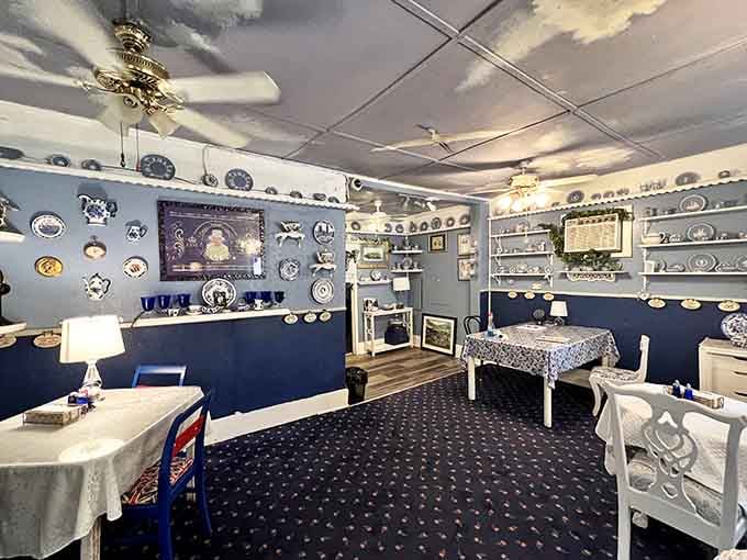 Blue and white plates cover every available surface like someone's china collection exploded in the most delightful way possible.