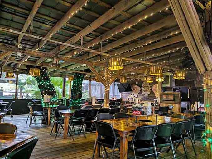 String lights and wooden beams create the kind of casual atmosphere where loosening your belt is encouraged.