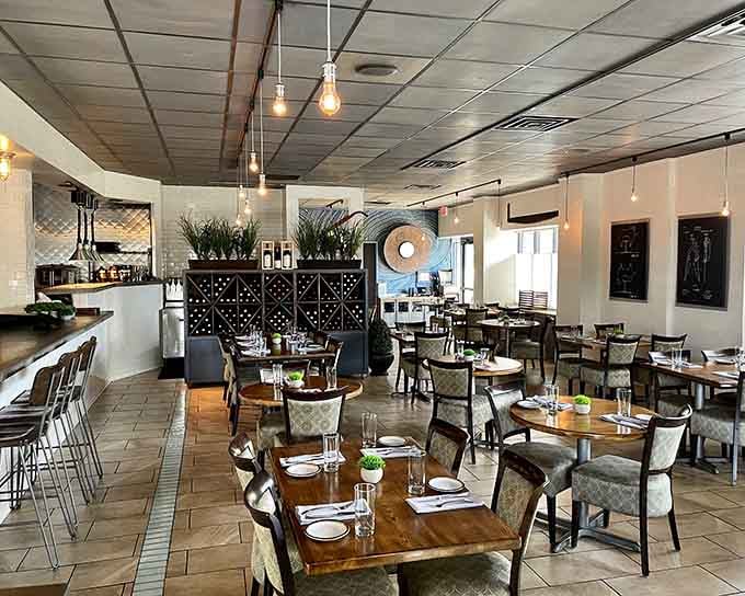 Step inside to discover a dining room where Edison bulbs and greenery create ambiance worthy of your anniversary.