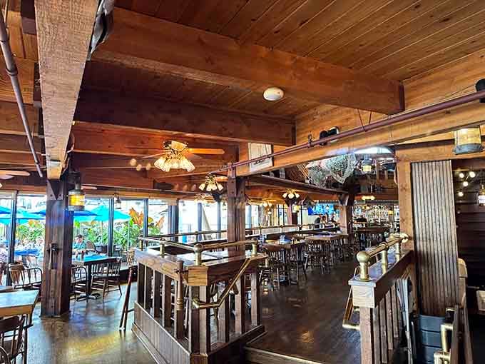 Rustic maritime charm meets comfortable dining where exposed beams tell stories and ceiling fans keep things breezy.
