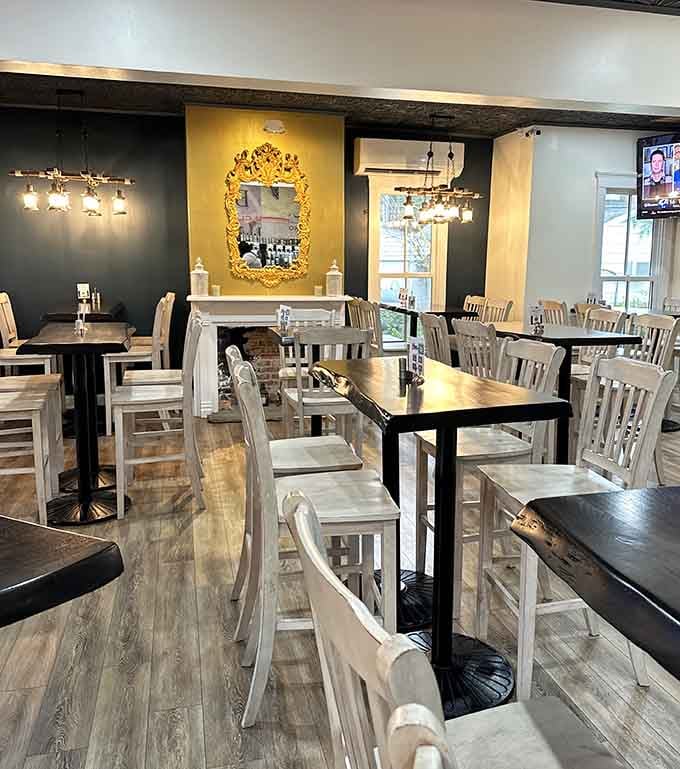 Dark walls meet white furniture in a design choice that somehow makes everyone look like they're having their best day.