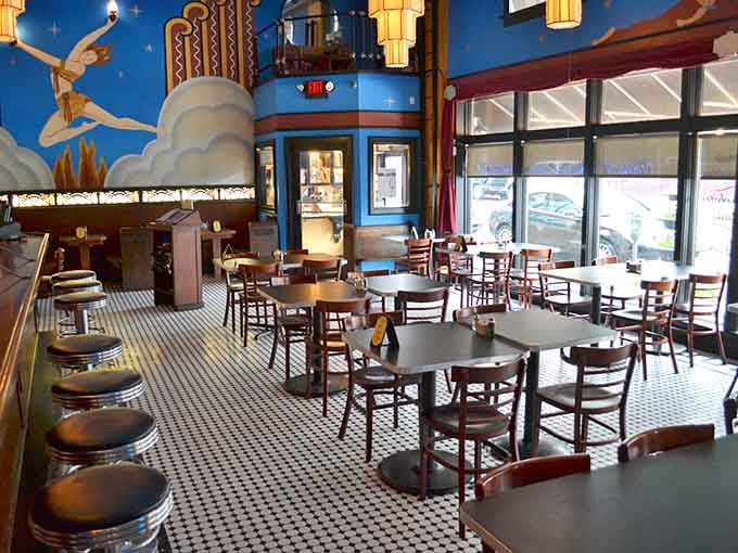 Step into a space where 1920s glamour meets whimsical wonderland, complete with soaring ceilings and celestial blue skies.