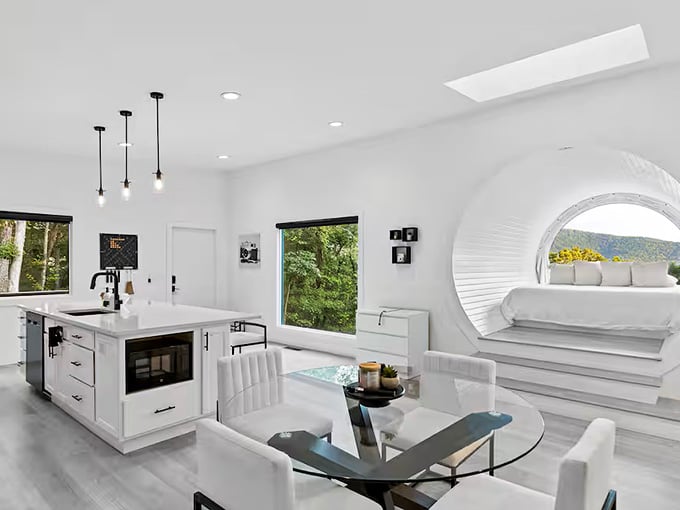 Clean lines and modern comfort meet inside this camera-shaped retreat where the bed literally sits inside a lens.