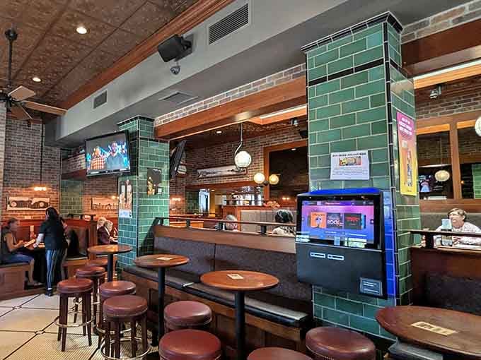 Modern updates meet classic tavern charm with those gorgeous green tiles and warm wood tones throughout.