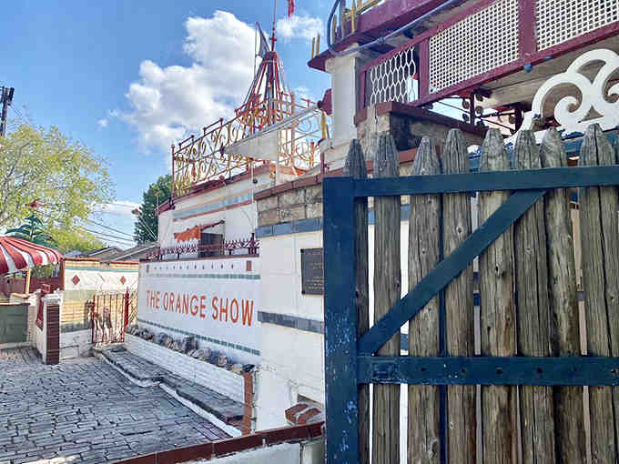 The entrance promises oranges and delivers pure architectural chaos, and somehow that's exactly what you want.