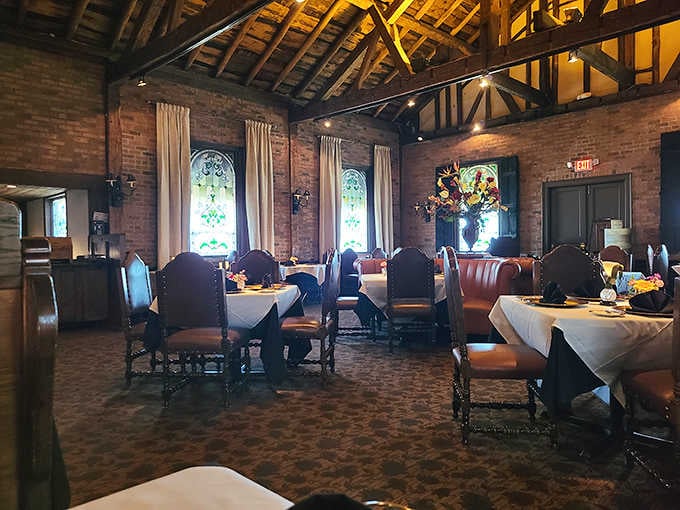 Those soaring beamed ceilings and exposed brick create an atmosphere that whispers "medieval monastery" but serves pure culinary magic.