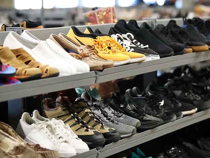 Rows of shoes waiting for their second act, from sneakers to heels, all ready for new adventures.