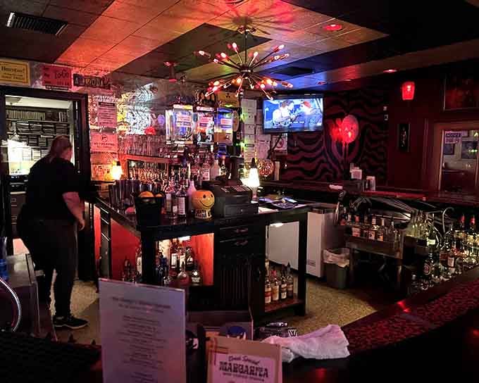 Step inside where red lighting and vintage vibes create an atmosphere that's equal parts cozy and delightfully apocalyptic.