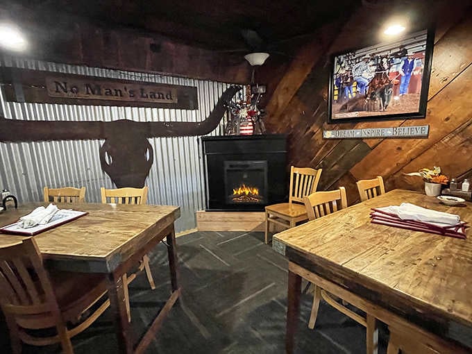 Rustic wooden tables, corrugated metal walls, and a fireplace create the kind of atmosphere where good stories are shared over great meals.