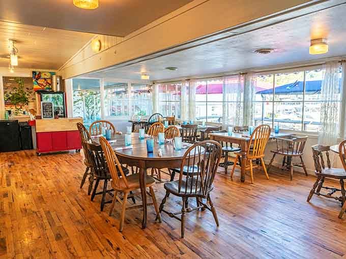 Wooden floors, mismatched chairs, and windows that let the light pour in like sweet tea on a summer day.