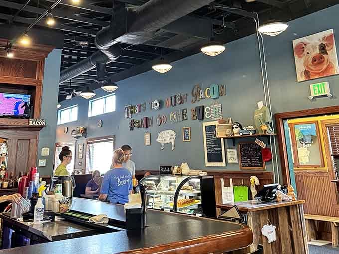 The blue walls and pig-themed decor create a space that's both whimsical and welcoming for breakfast adventures.