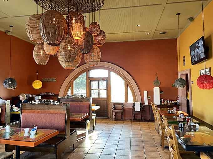 Those arched doorways and eclectic light fixtures create an atmosphere that makes scrambled eggs feel like a special occasion.