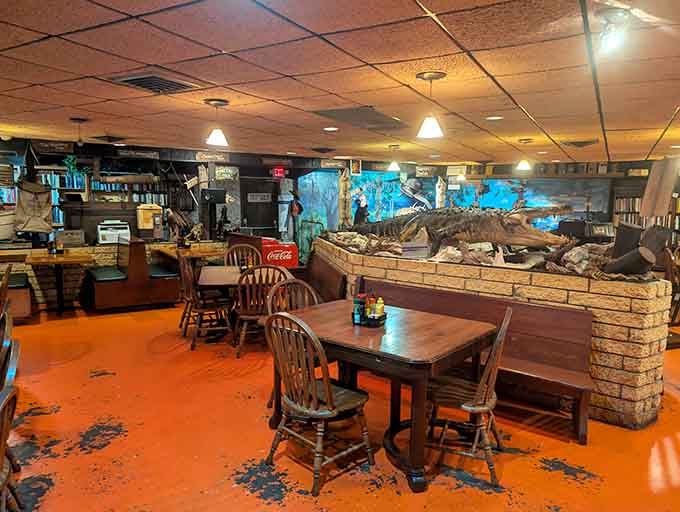 That orange floor has seen decades of satisfied diners, and those wooden chairs hold stories worth hearing over dinner.