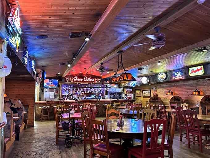 Wood-paneled warmth meets neon glow inside Three Sisters, where Western heritage feels refreshingly alive and inviting.