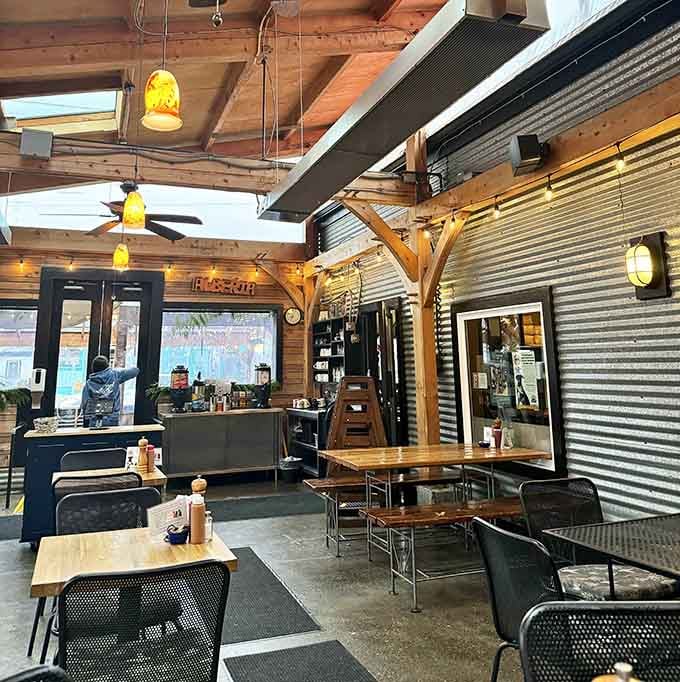 Exposed beams and industrial chic meet cozy breakfast nook in this wonderfully eclectic space.