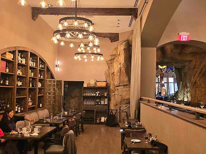 Rustic wood beams and wine displays create an atmosphere where carbs and conversation flow equally well.